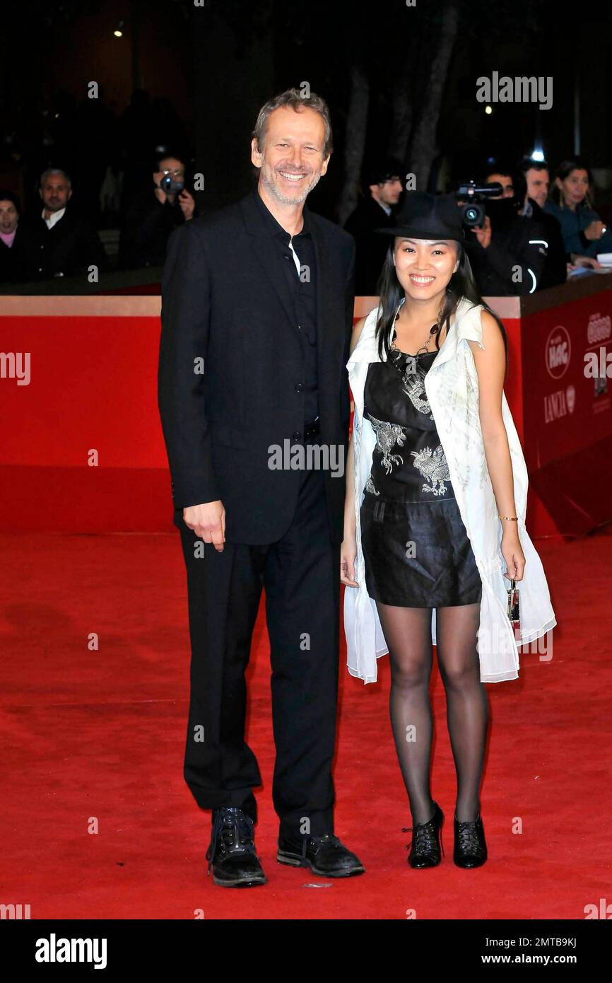 Director and writer Alexandre Rockwell and Jennifer Li pose on the red ...