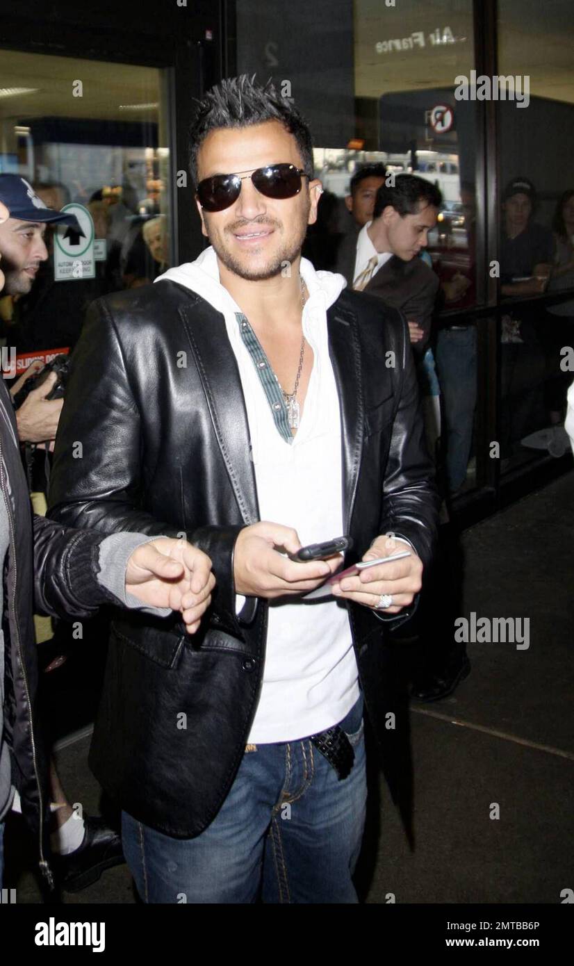 Peter Andre arrives at LAX with a gentleman he introduces as his ...