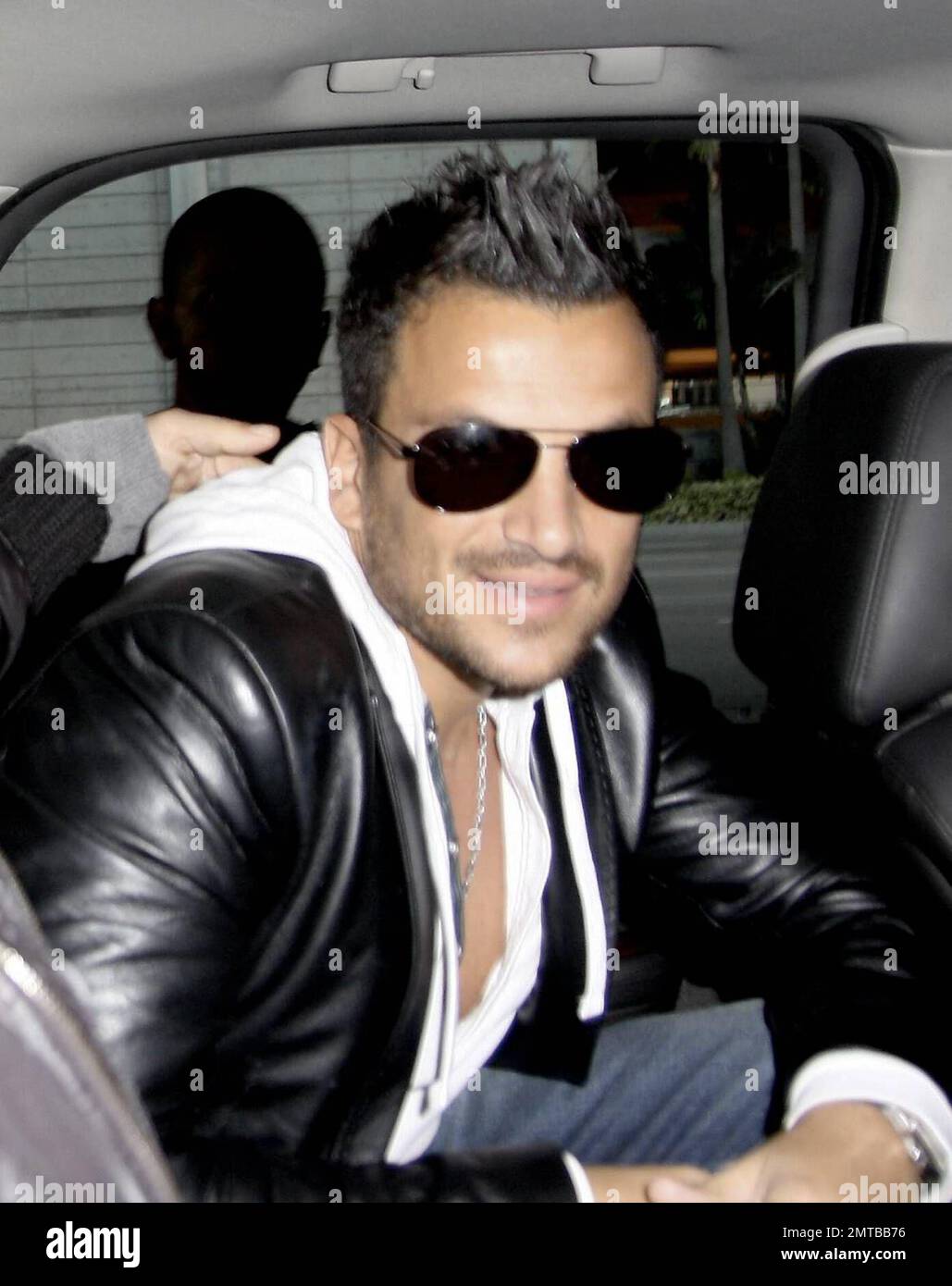 Peter Andre arrives at LAX with a gentleman he introduces as his ...