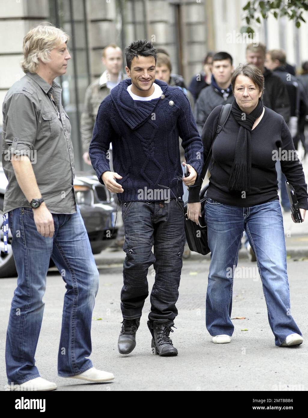 Wearing a classic cable-knit sweater and jeans, Peter Andre is all ...