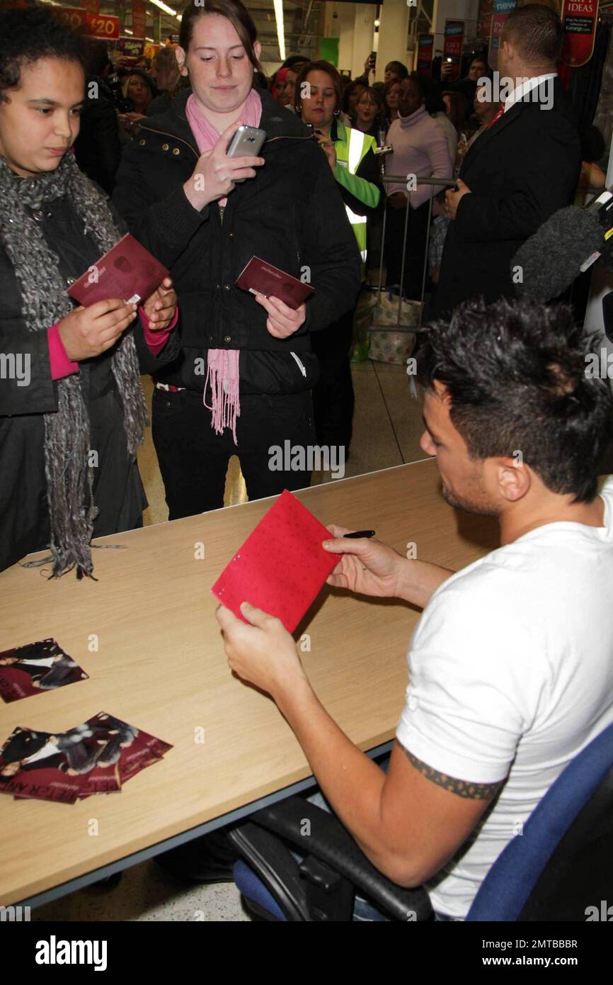 Pop singer Peter Andre poses with a CD of his latest single 'Defender ...