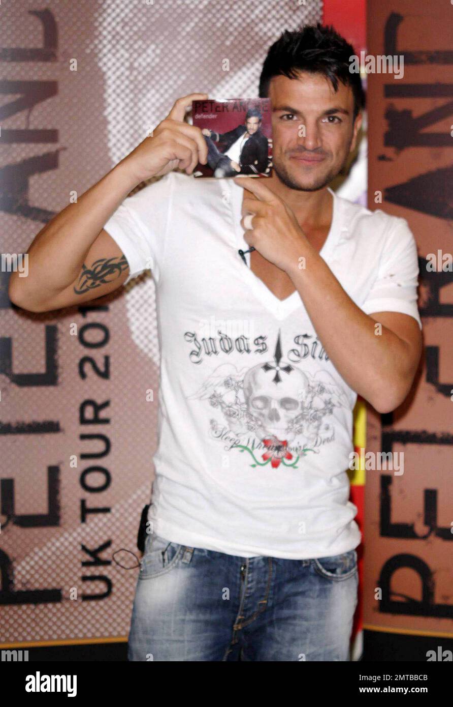 Pop singer Peter Andre poses with a CD of his latest single 'Defender ...