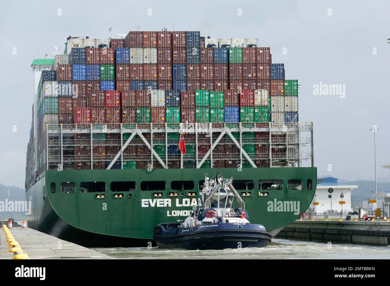 A Neo-Panamax cargo ship is guided through the Cocoli locks, part of ...