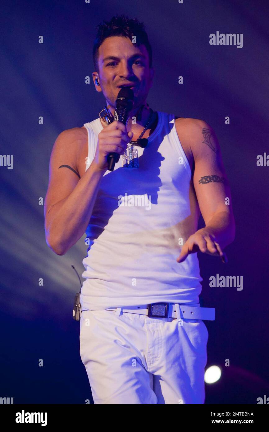 Peter Andre, decked out in both white and red outfits, performs at the ...