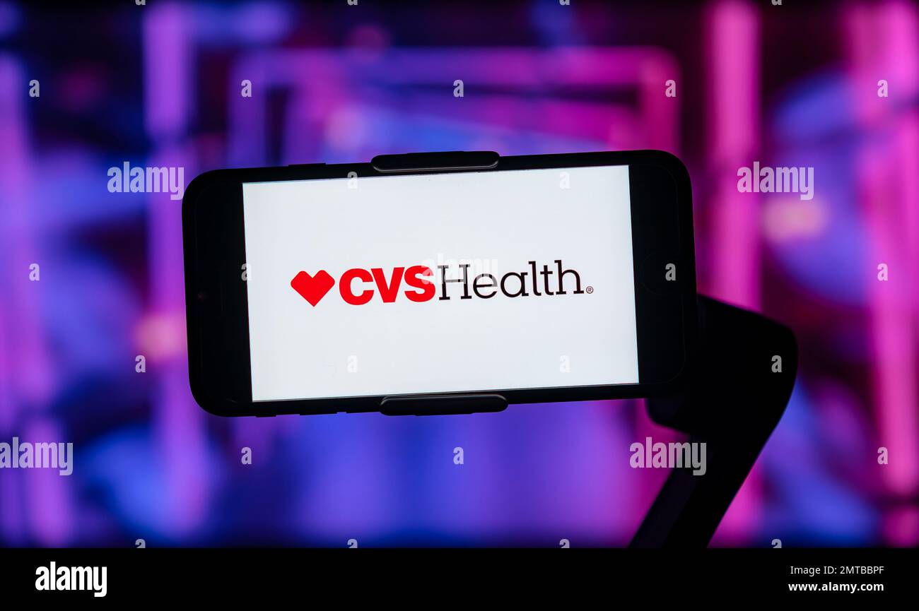 In this photo illustration, the logo of CVS Health seen displayed on a ...