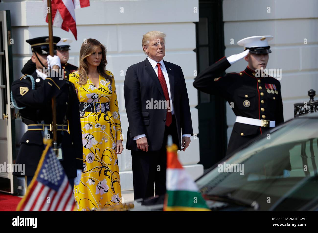 President Donald Trump and first lady Melania Trump await the arrival ...