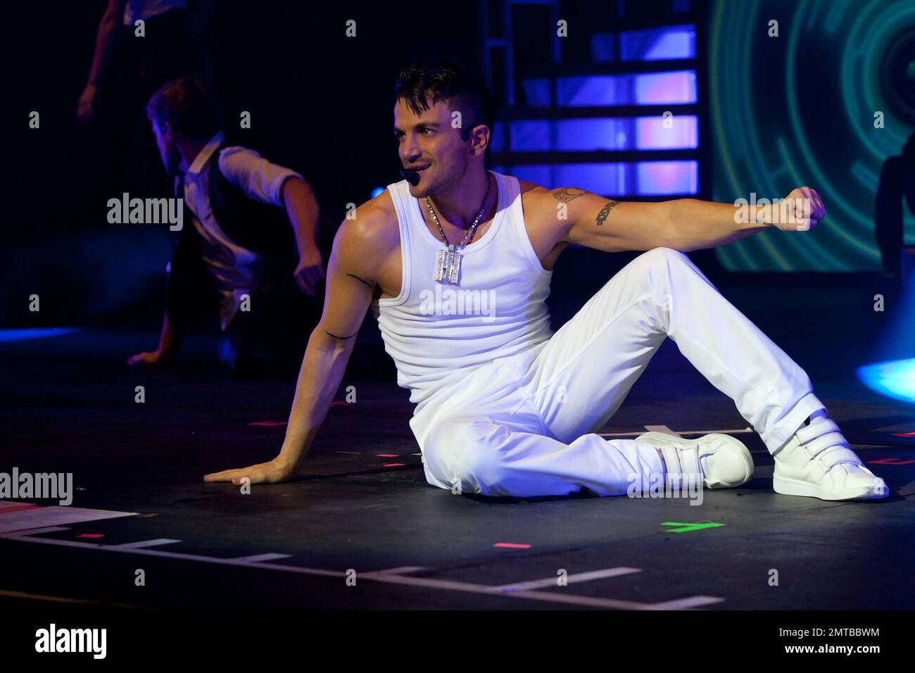Peter Andre, decked out in both white and red outfits, performs at the ...