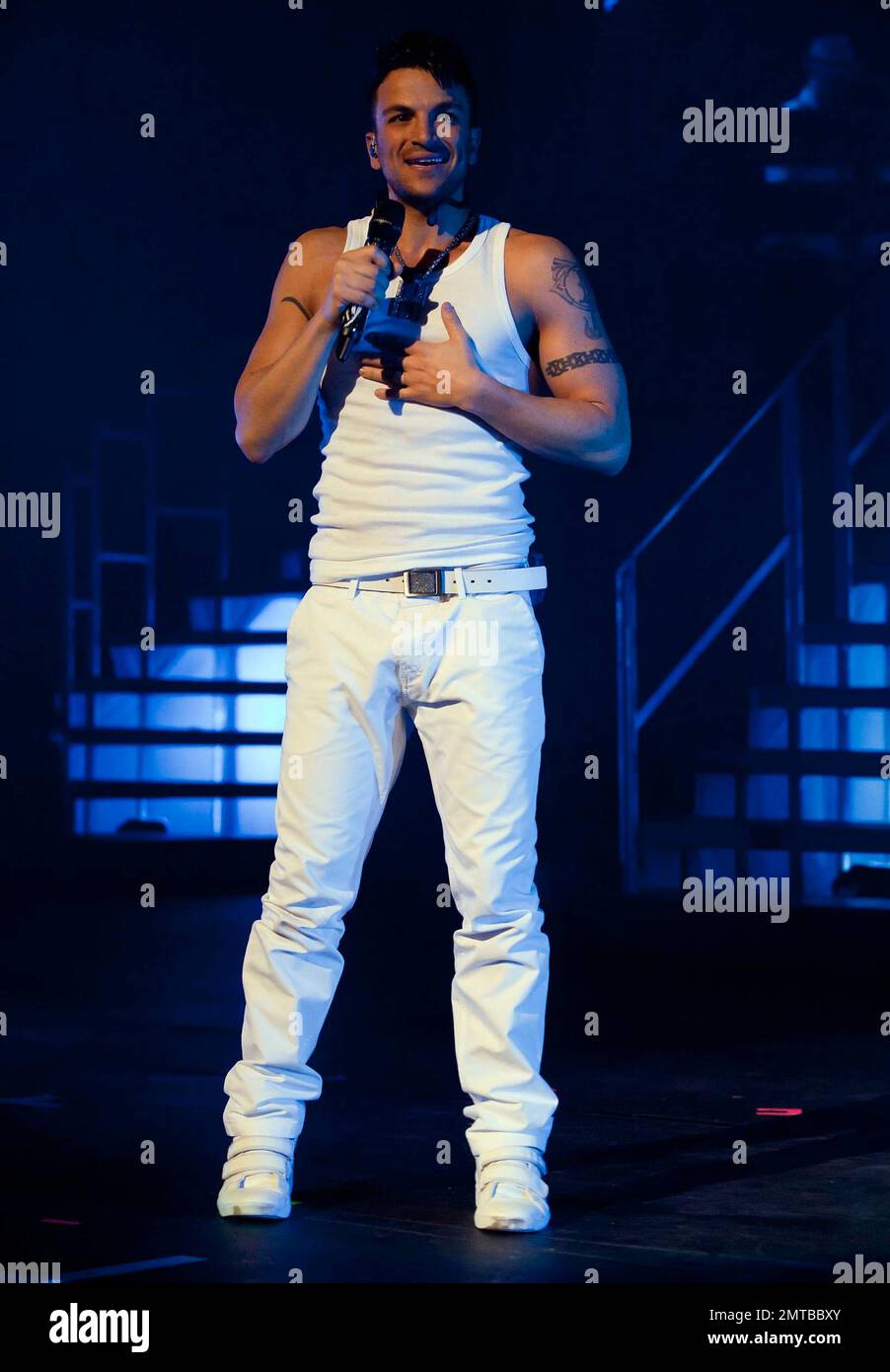 Peter Andre, decked out in both white and red outfits, performs at the ...