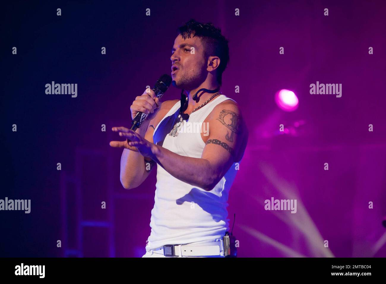 Peter Andre, decked out in both white and red outfits, performs at the ...