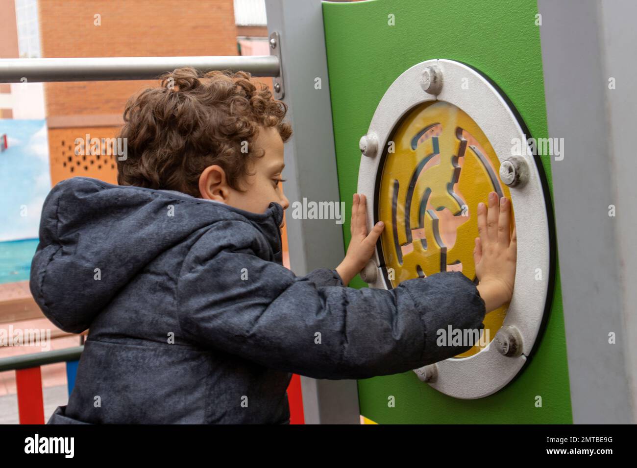 The maze ball in which the child play on the playground in the city ...