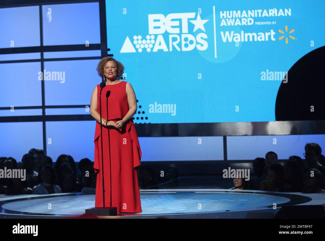 Debra Lee, chairman and CEO, BET, presents the humanitarian award at ...