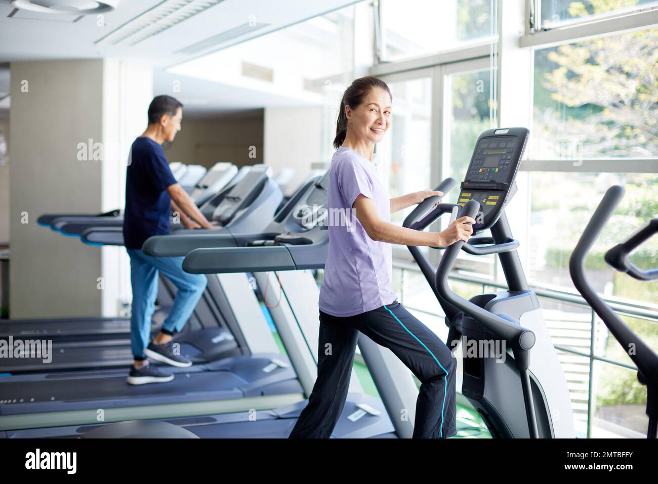 Japanese senior couple training at indoor gym Stock Photo - Alamy