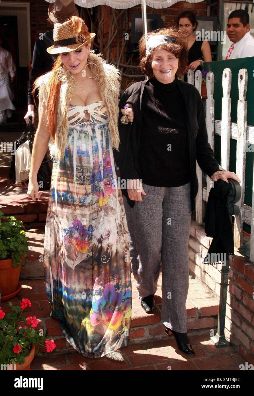 Phoebe Price strikes a seductive pose as she shows off her lunch while ...