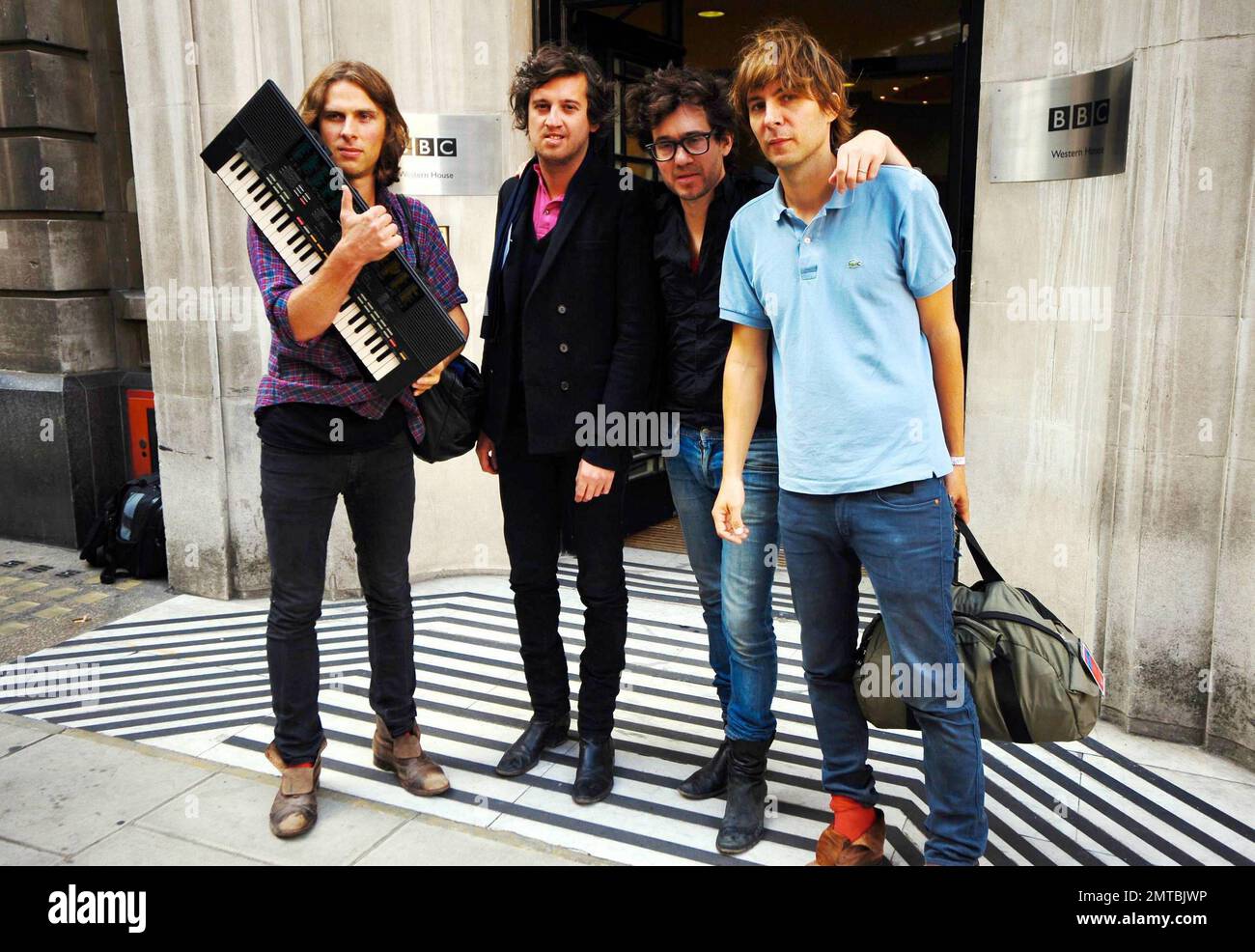 Grammy award-winning French band Phoenix poses for photos outside the ...