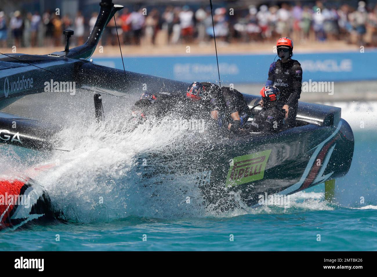 Emirates Team New Zealand helmsman Peter Burling, right, steers as they ...
