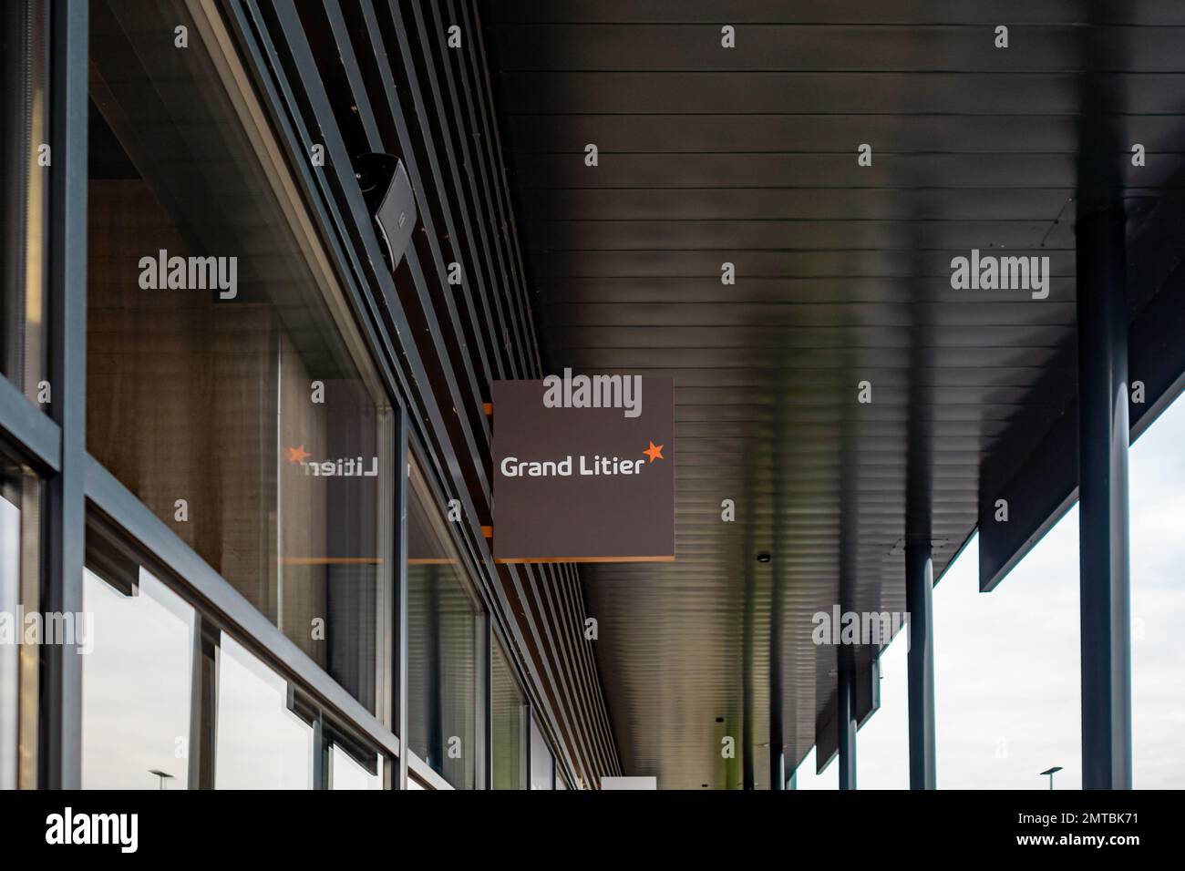 A small logo of the GRAND LITIER reflecting on a window outdoors Stock ...