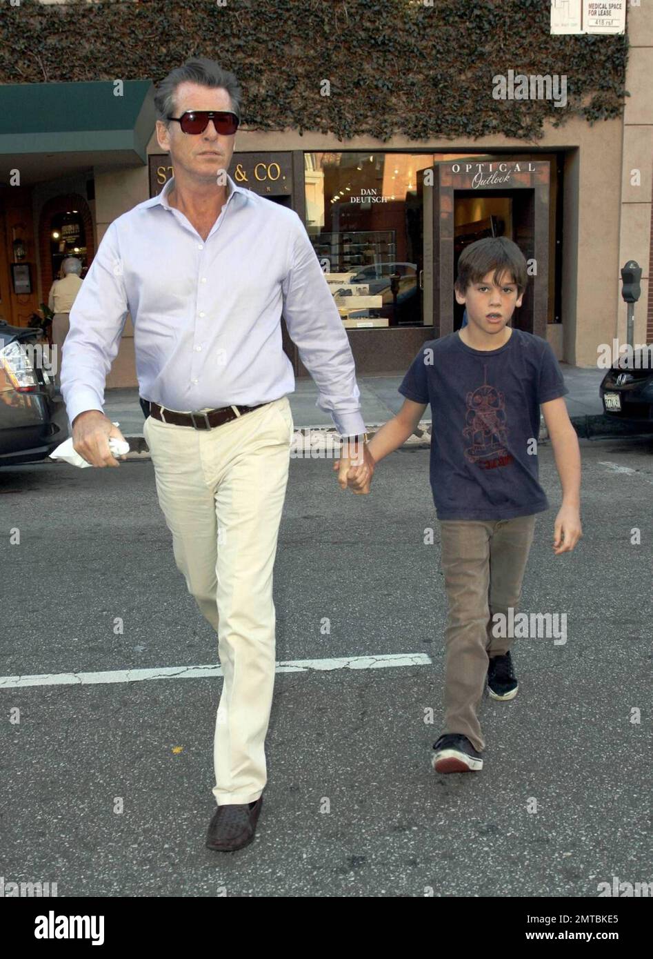 Pierce Brosnan 'Bonds' with his son Dylan as they walk hand in hand ...