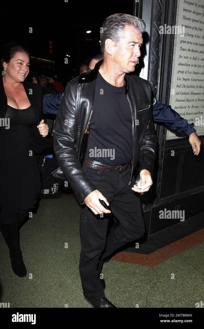 Pierce Brosnan signs autographs as he arrives at the Sting concert at ...