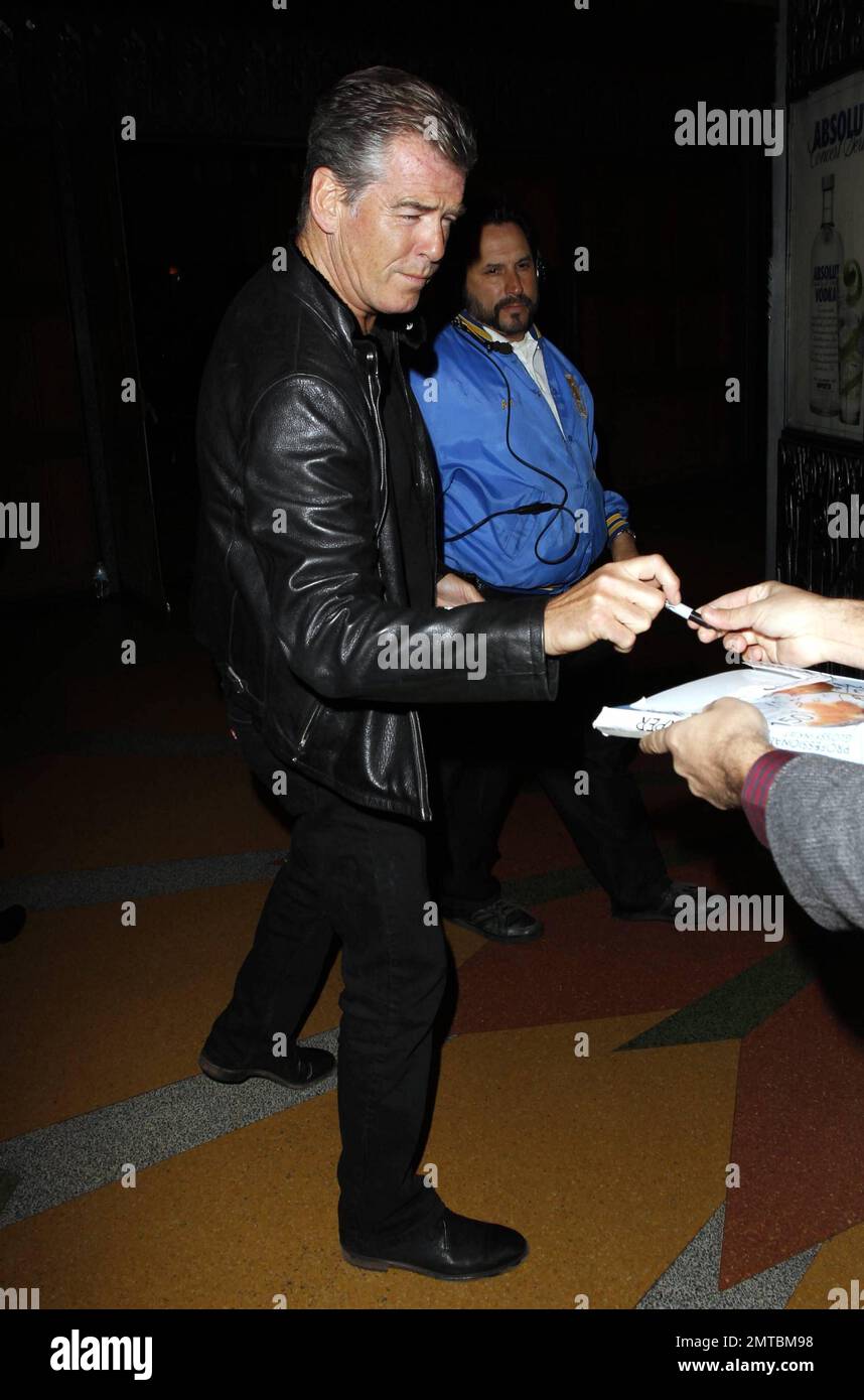 Pierce Brosnan signs autographs as he arrives at the Sting concert at ...