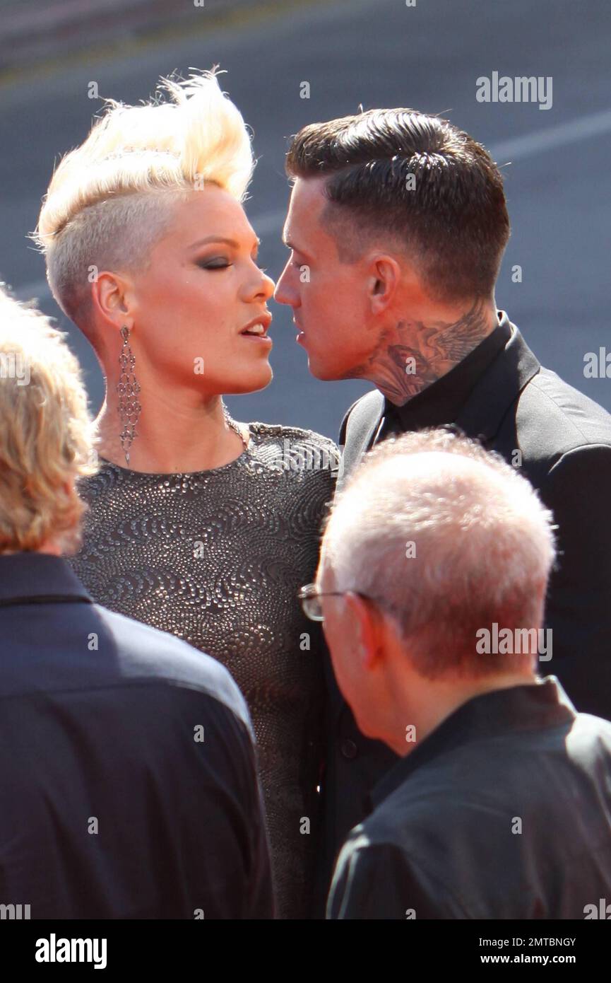 Wearing a silver patterned floor length dress with sparkling earrings ...