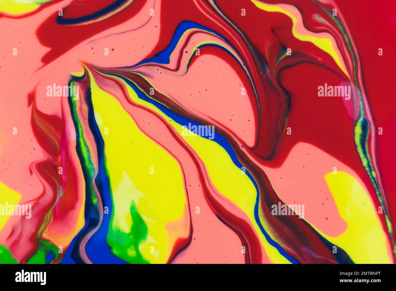 A colorful paint of red, yellow, blue and green colors combination ...