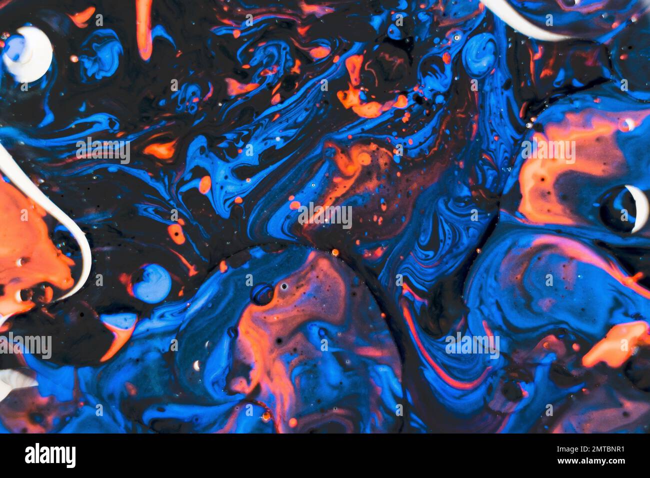 A colorful paint of red, yellow, blue and green colors combination ...