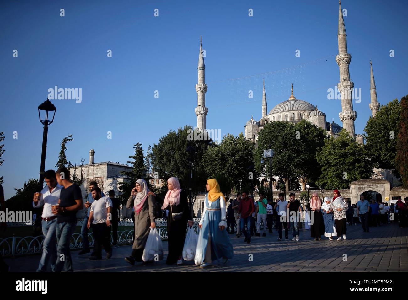 Turkish Muslims leave after Eid al-Fitr prayers at the city's landmark ...