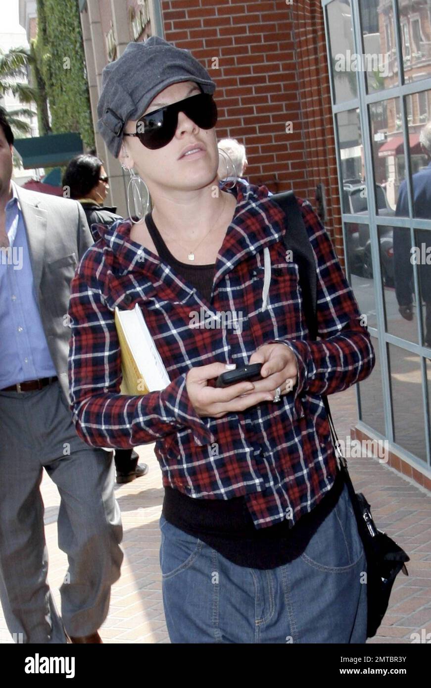 Singer Pink keeps her head as she texts while strolling in Beverly ...