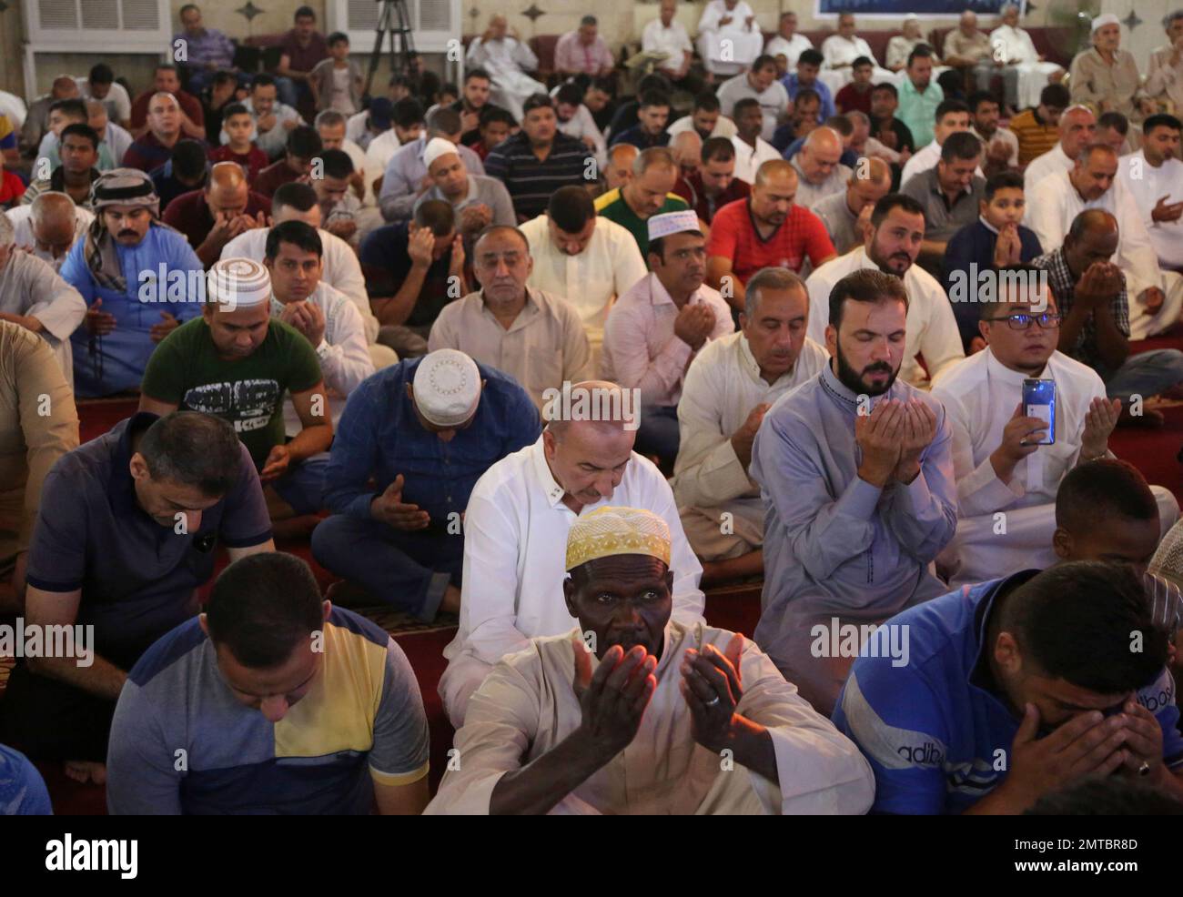 Iraqi Sunni Muslims pray on the first day of Eid al-Fitr prayers in ...