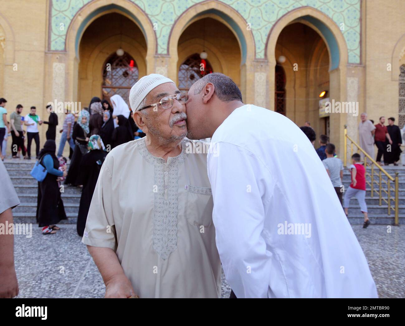 Iraqi Sunni Muslims exchange greetings on the first day of Eid al-Fitr ...