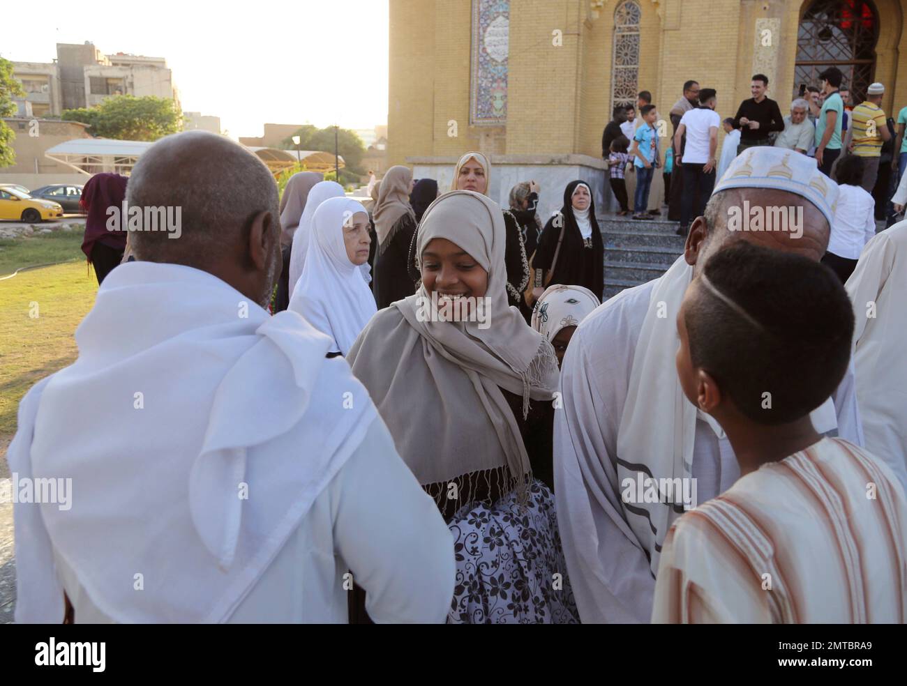 Iraqi Sunni Muslims exchange greetings on the first day of Eid al-Fitr ...