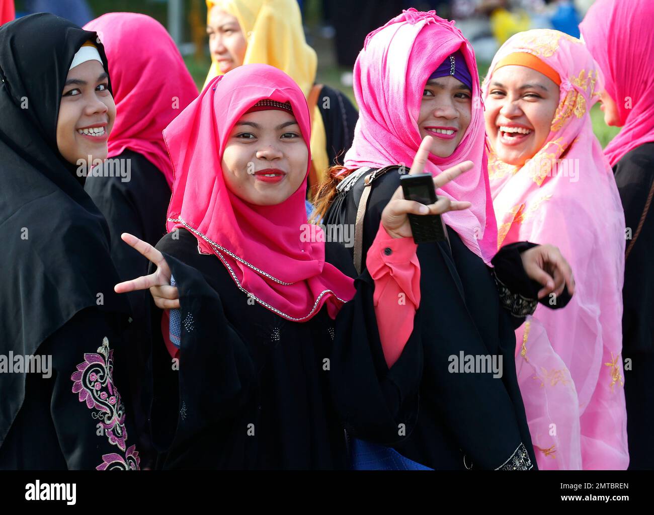Filipino Muslims gesture following early morning prayers at Manila's ...