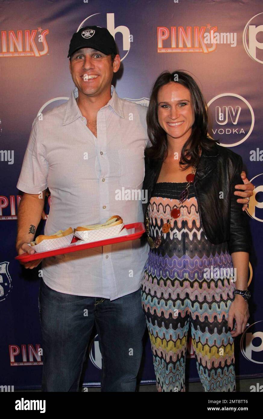 Owner Billy Pink and sister pose on the pink carpet with a hot dog to ...