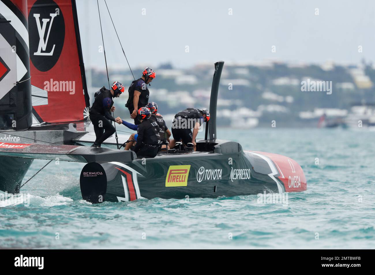 Glenn Ashby, left, skipper for Emirates Team New Zealand, celebrates ...