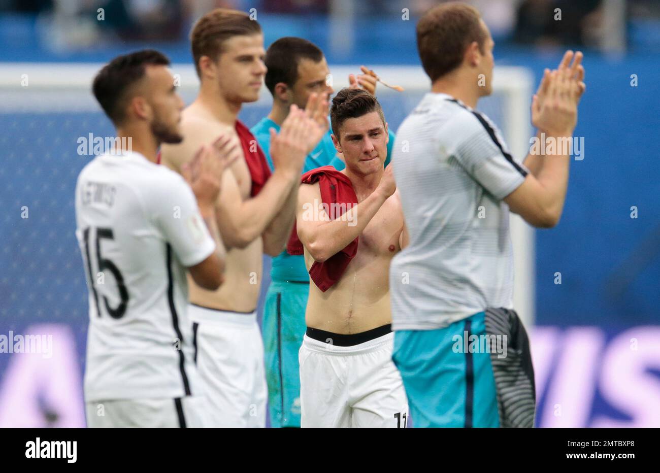 New Zealand's Marco Rojas, center, and teammates applaud as they leave ...