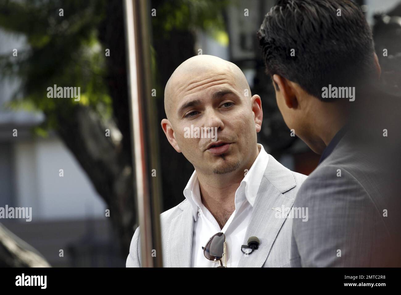 Rapper Pitbull makes an appearance for an interview with Mario Lopez at ...