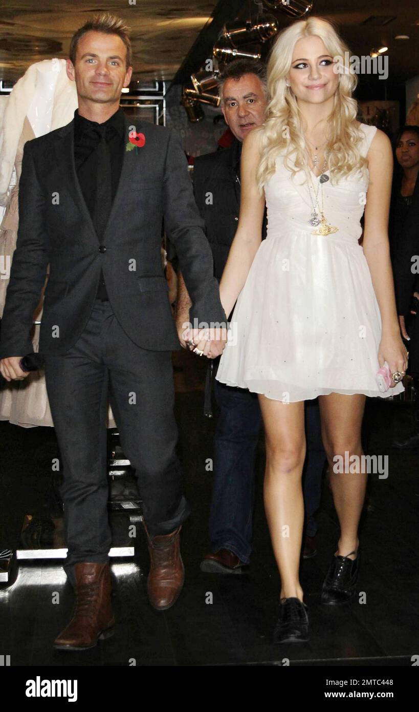 Singer Pixie Lott wears a cute white baby-doll dress and black lace up ...