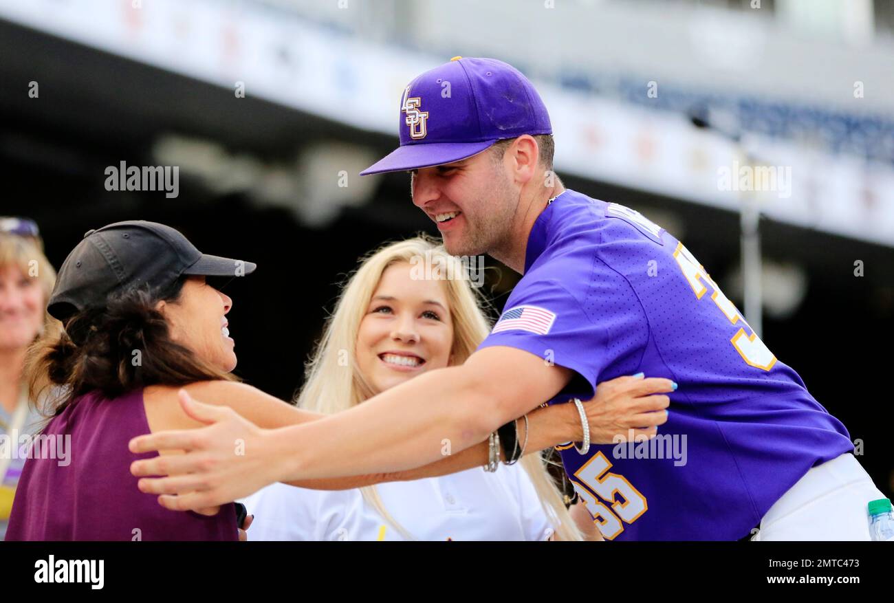 LSU pitcher Alex Lange (35) hugs a loved one as his girlfriend Ashlyn ...