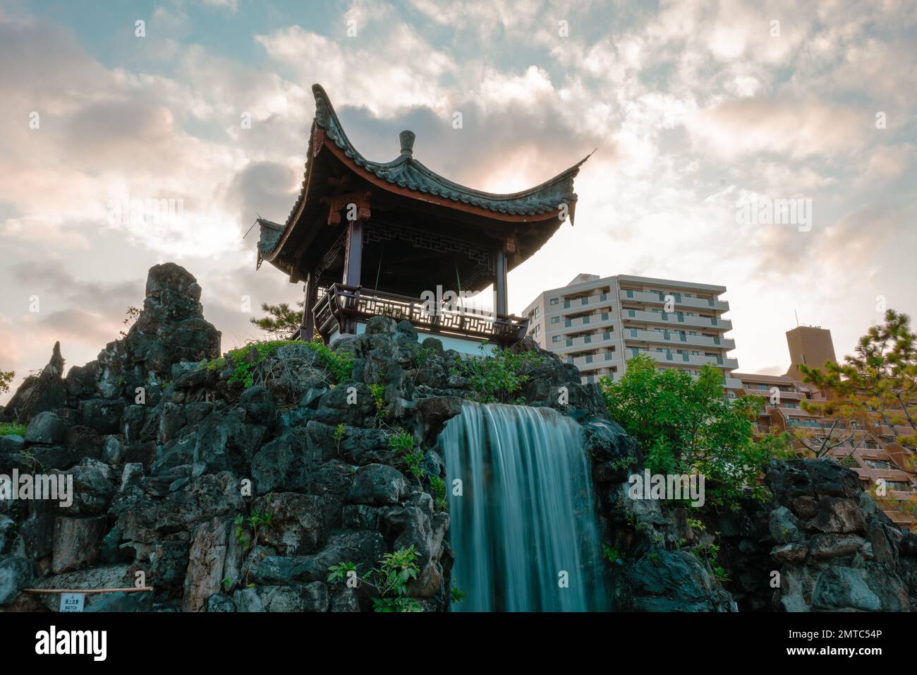 The pagoda and waterfall in Fukushuen Chinese Garden in Naha Okinawa ...