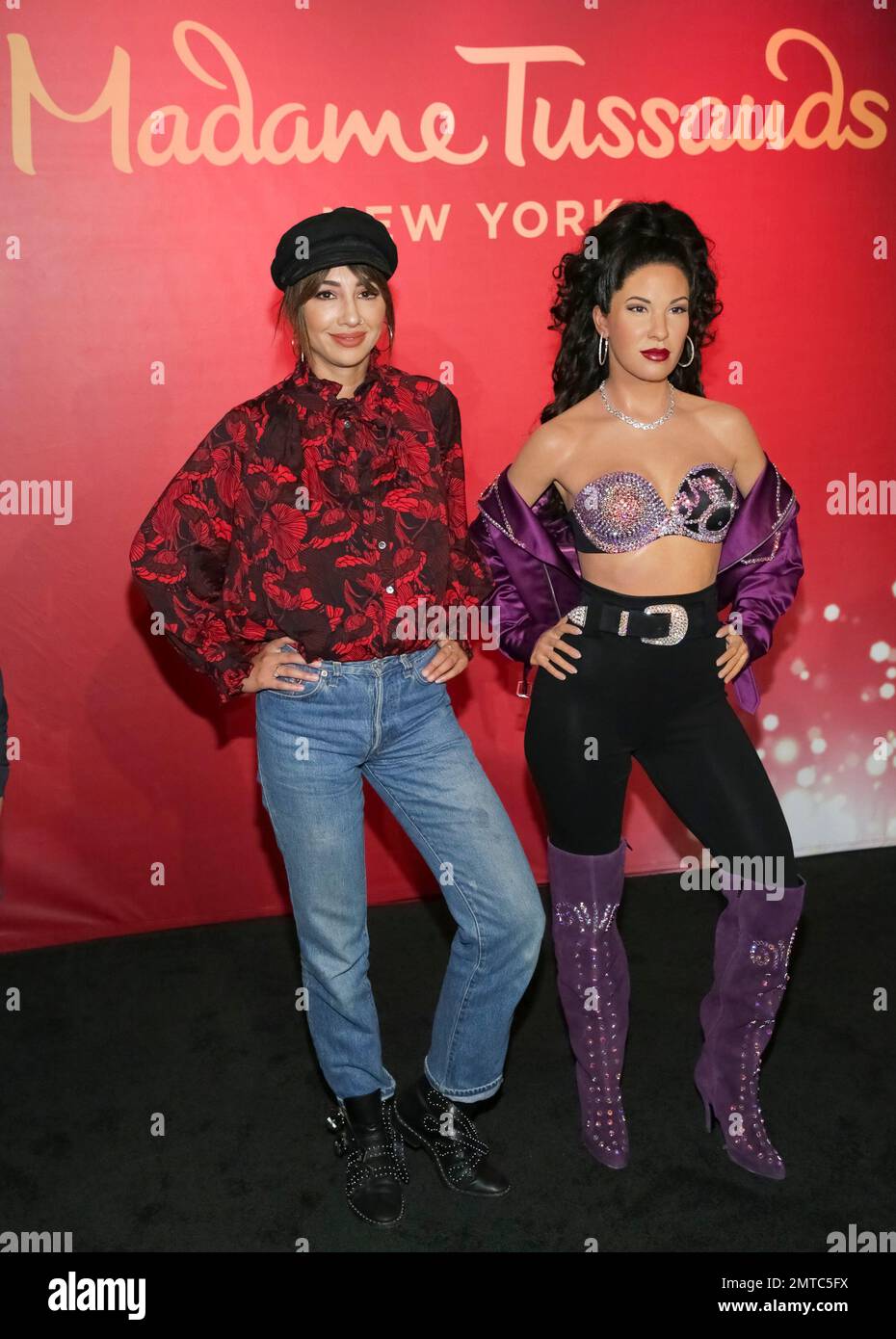 Actress Jackie Cruz, left, poses with Selena Quintanilla's wax figure ...