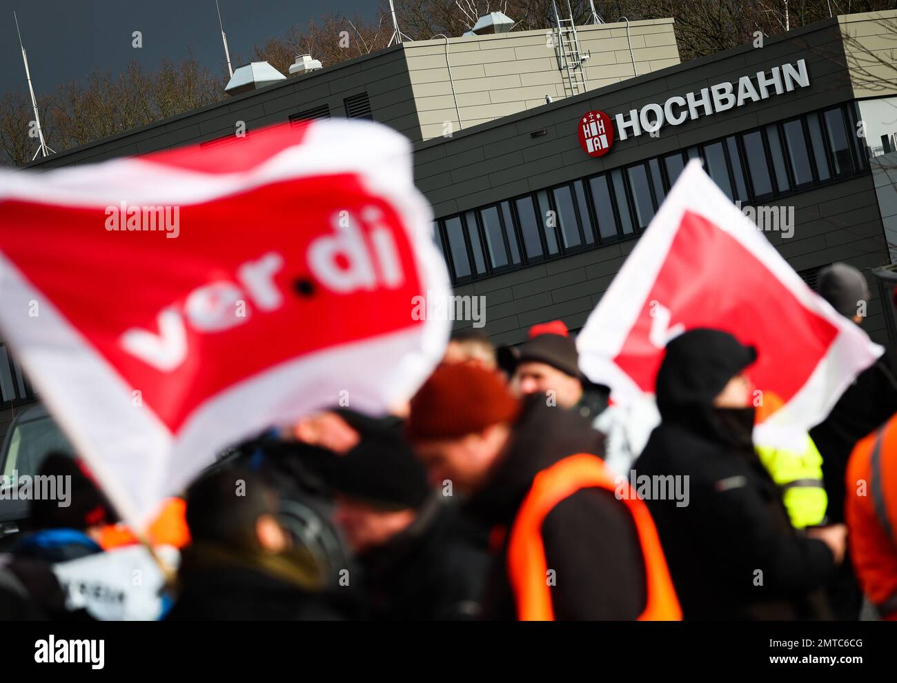 Hamburg, Germany. 01st Feb, 2023. Striking employees stand at a picket ...