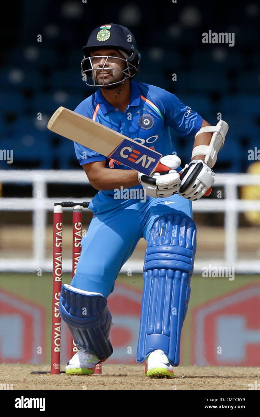 India's Ajinka Rahane eyes the ball after playing a shot delivered by ...