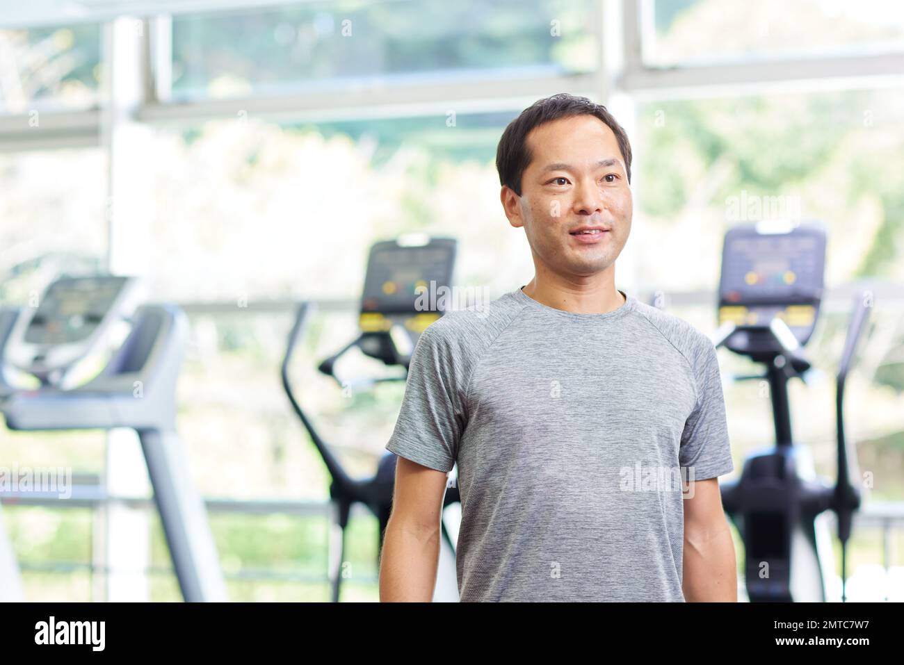 Japanese man training at indoor gym Stock Photo - Alamy