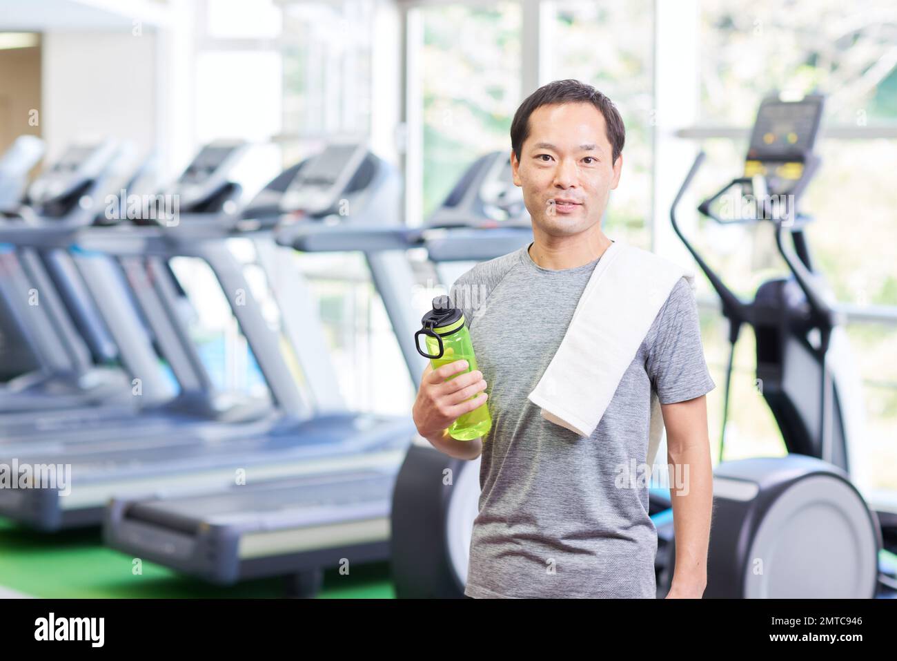 Japanese man training at indoor gym Stock Photo - Alamy