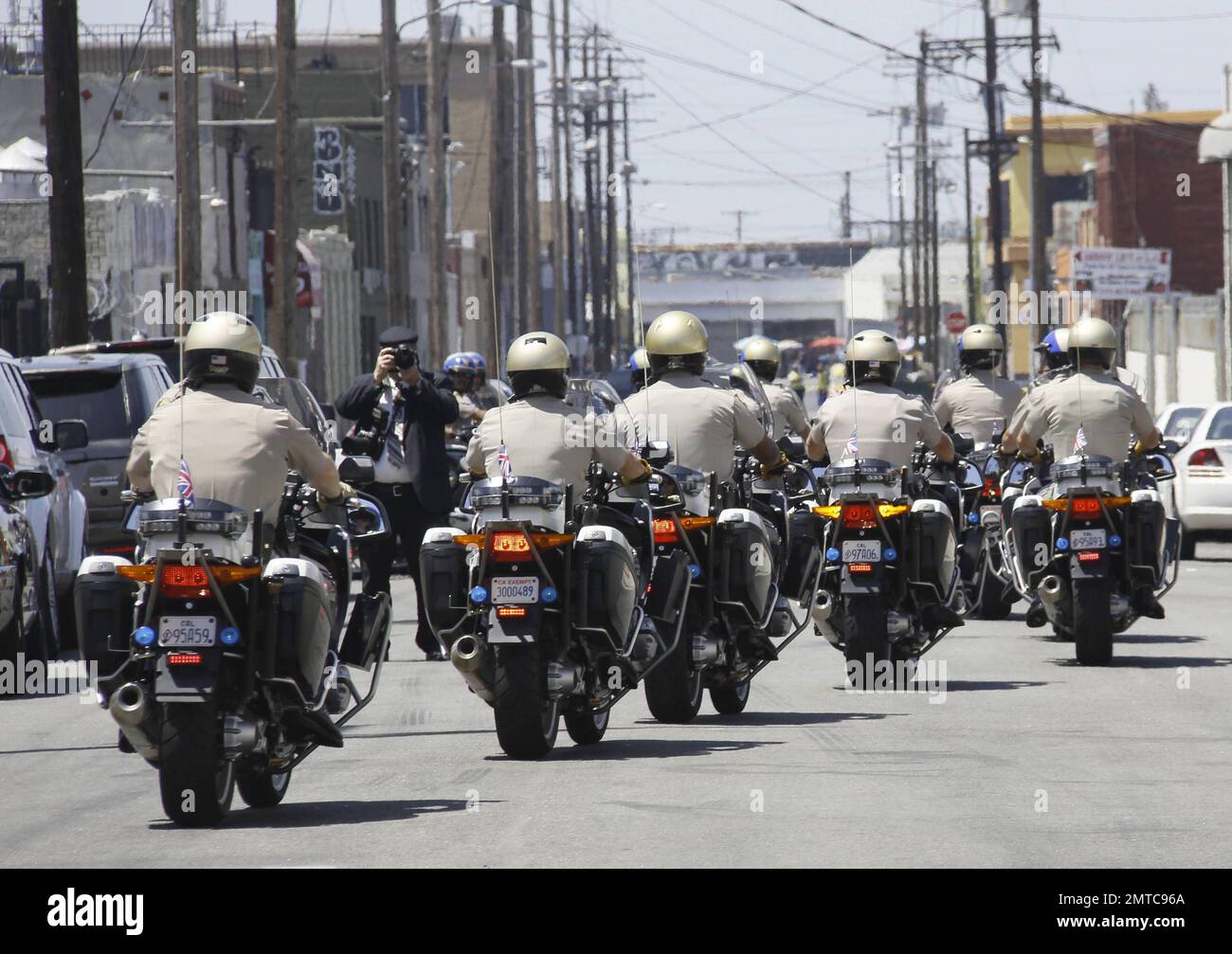 Police form a motorcade with their bikes, complete with mini Union Jack ...