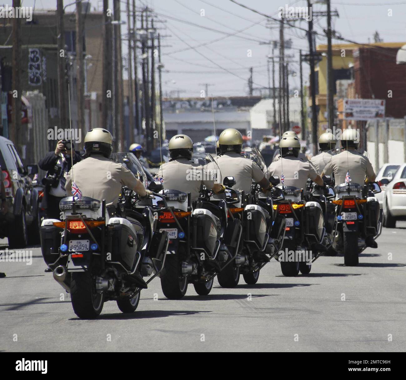 Police form a motorcade with their bikes, complete with mini Union Jack ...