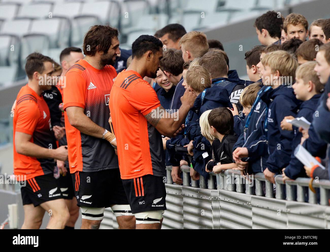 All Blacks members sign autographs for fans during the captain's run at ...