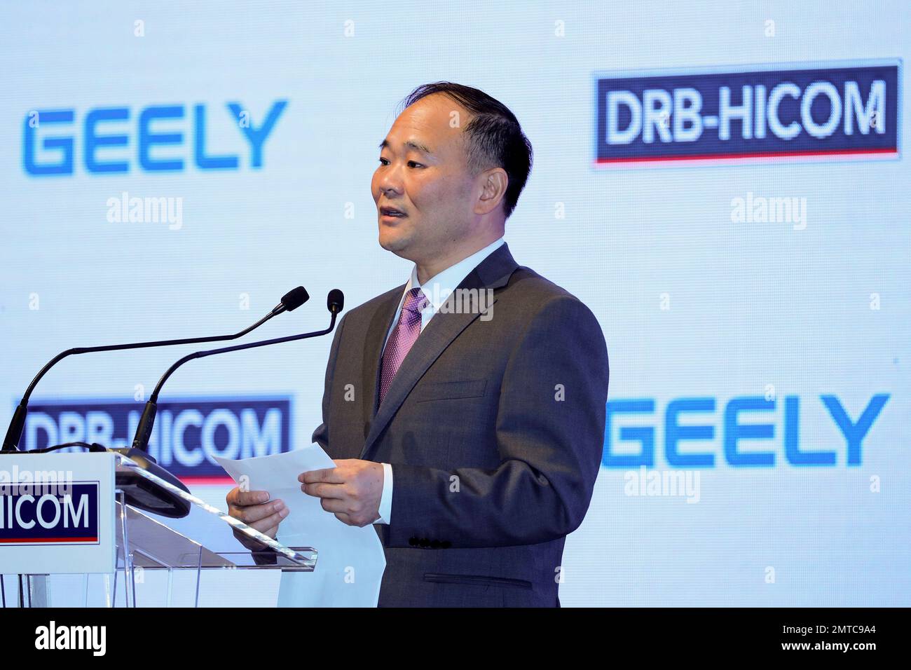 Zhejiang Geely Holding Group Chairman Li Shufu delivers a speech before ...