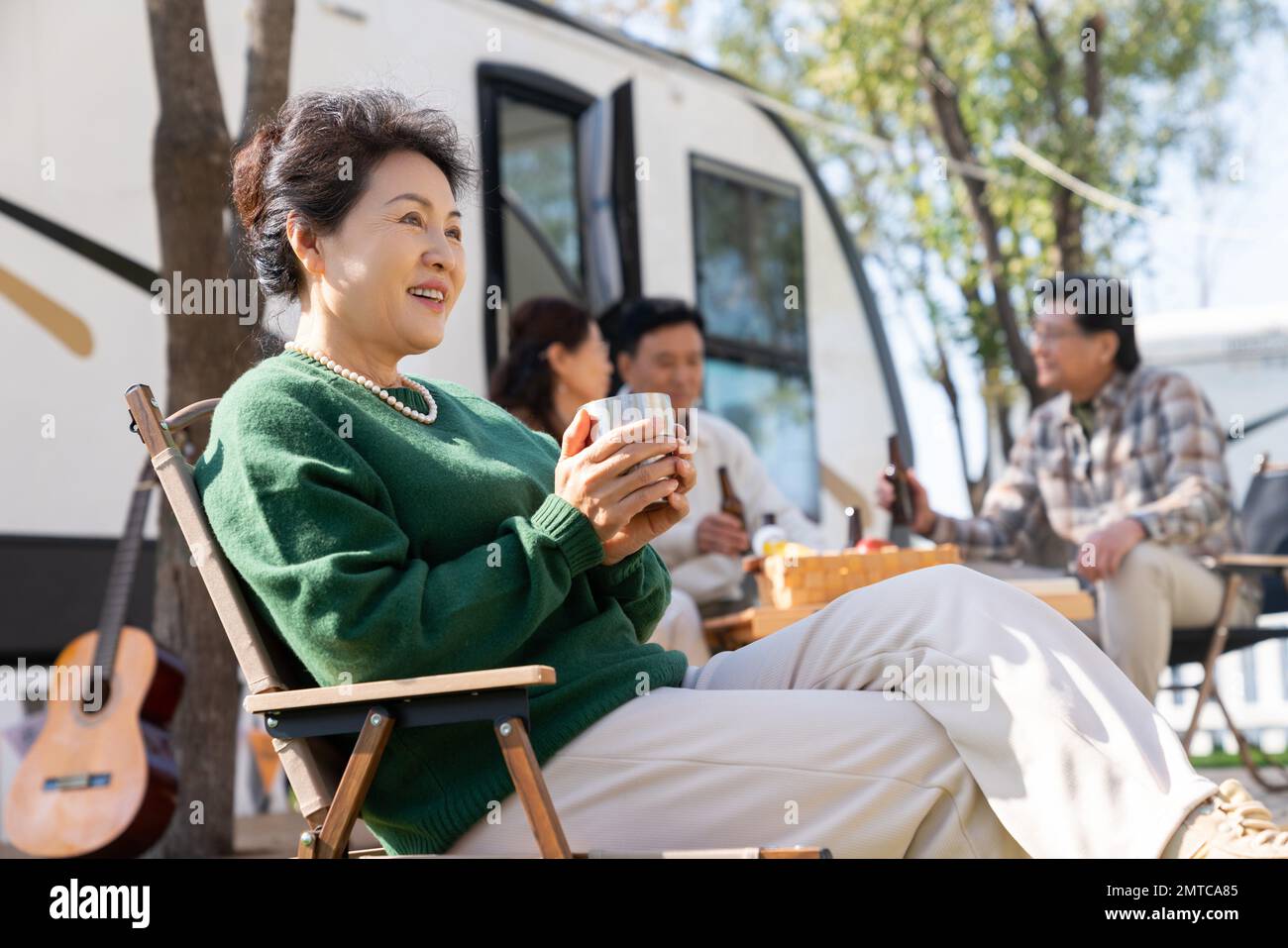 Woman guitar sitting rv hi-res stock photography and images - Alamy