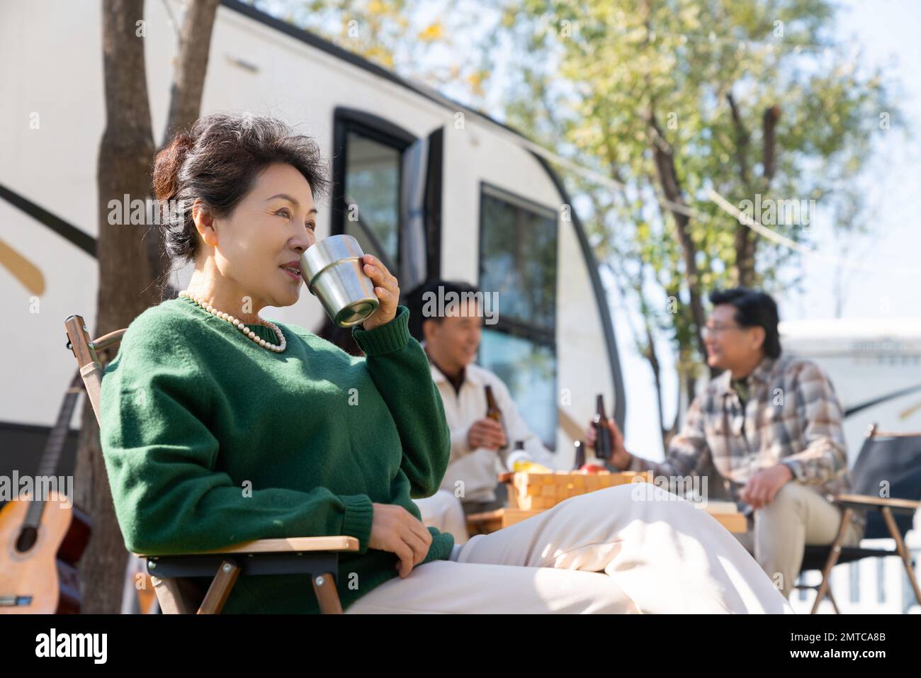 Woman guitar sitting rv hi-res stock photography and images - Alamy